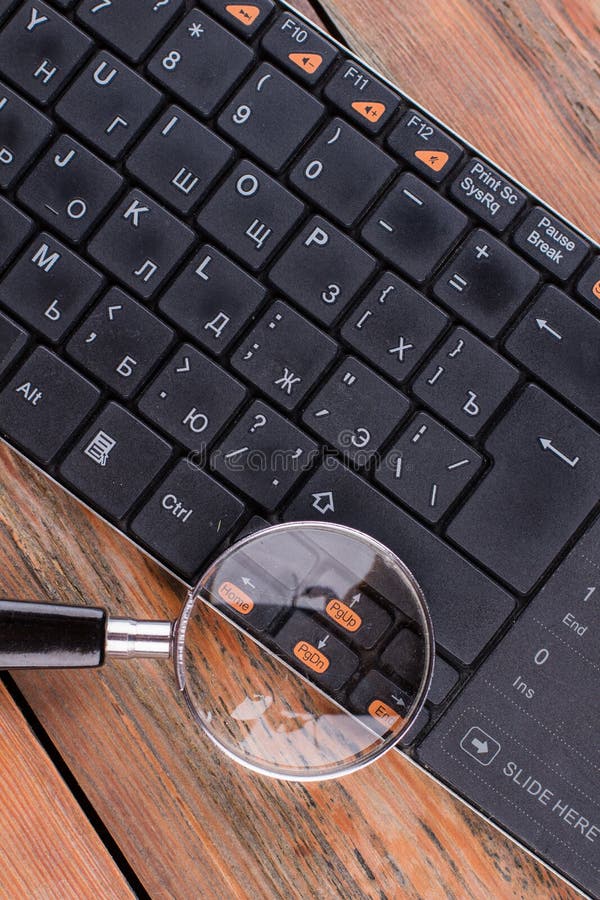Magnifying Glass Over Arrows Key in the Keyboard. Stock Photo - Image ...