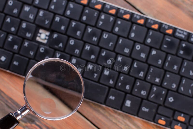 Magnifying Glass Over Black Keyboard. Stock Image - Image of market ...