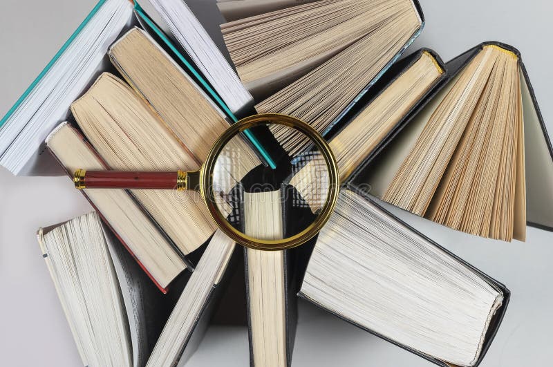 Magnifying Glass Over Different Books. Concept of Knowledge and ...