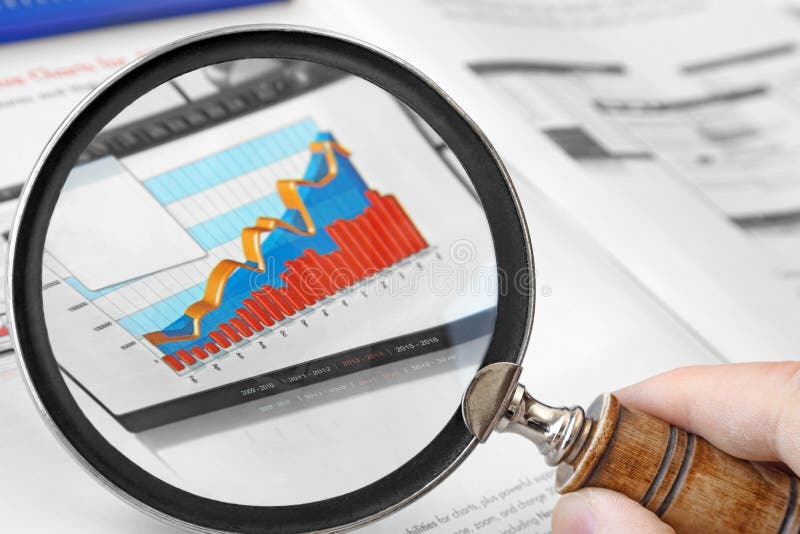 Magnifying Glass Over Financial Graph Stock Photo - Image of examining ...