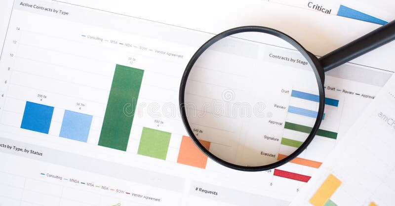 A Magnifying Glass Over Graph on Table Stock Photo - Image of number ...