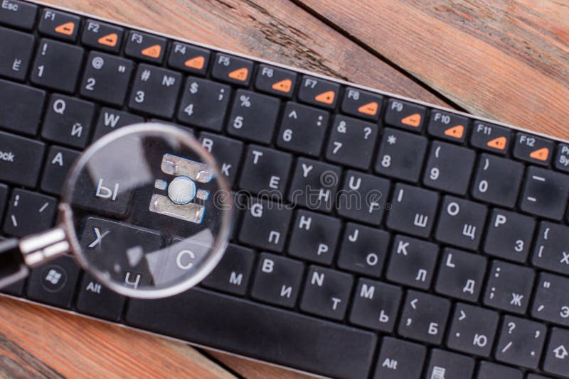 Magnifying Glass Over Missing Key in the Keyboard. Stock Image - Image ...