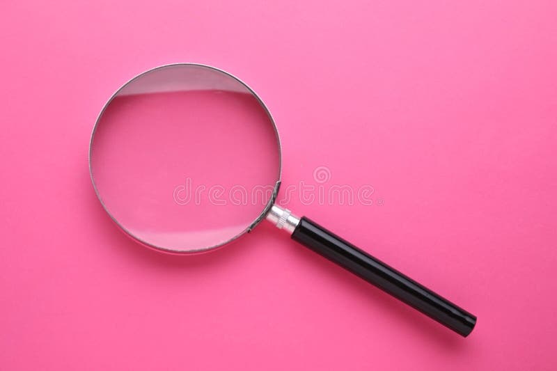 Magnifying Glass on Pink Background, Top View Stock Photo - Image of ...
