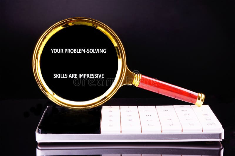 A Magnifying Glass Rests on a Calculator, Showcasing the Phrase about ...