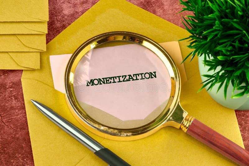 A Magnifying Glass Rests Over a Note Labeled Monetization, Surrounded ...