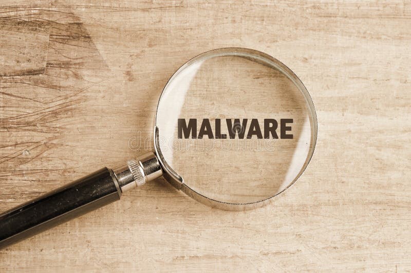 A Magnifying Glass Reveals the Word Malware, Emphasizing the Importance ...