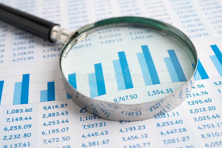 Magnifying Glass on Spreadsheet and Graph Paper Stock Photo - Image of ...