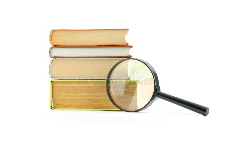 Magnifying Glass beside a Stack of Books Stock Photo - Image of color ...