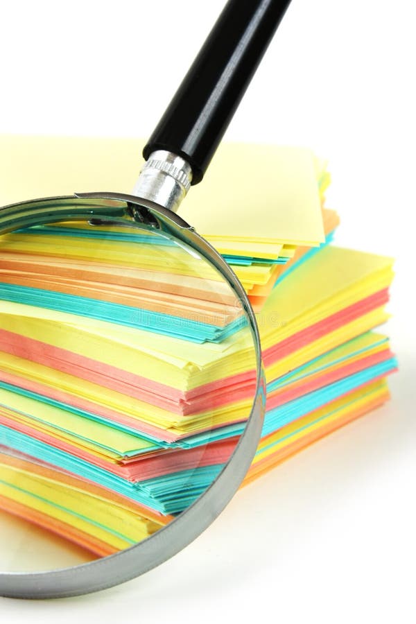 Magnifying Glass and a Stack of Paper Stock Photo - Image of yellow ...
