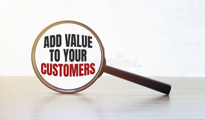 Magnifying Glass with Text ADD VALUE TO YOUR CUSTOMERS on Wooden Table ...