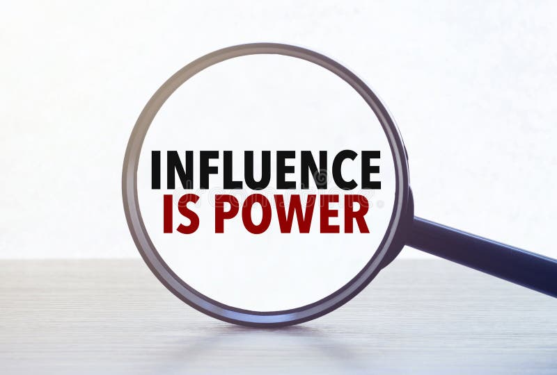 Magnifying Glass with Text Influence is Power on Wooden Table Stock ...