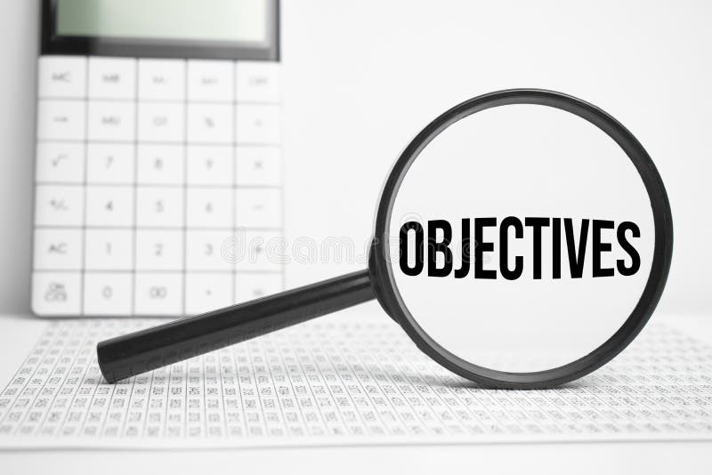 Magnifying Glass with Text Objectives on White Table with Calculator ...