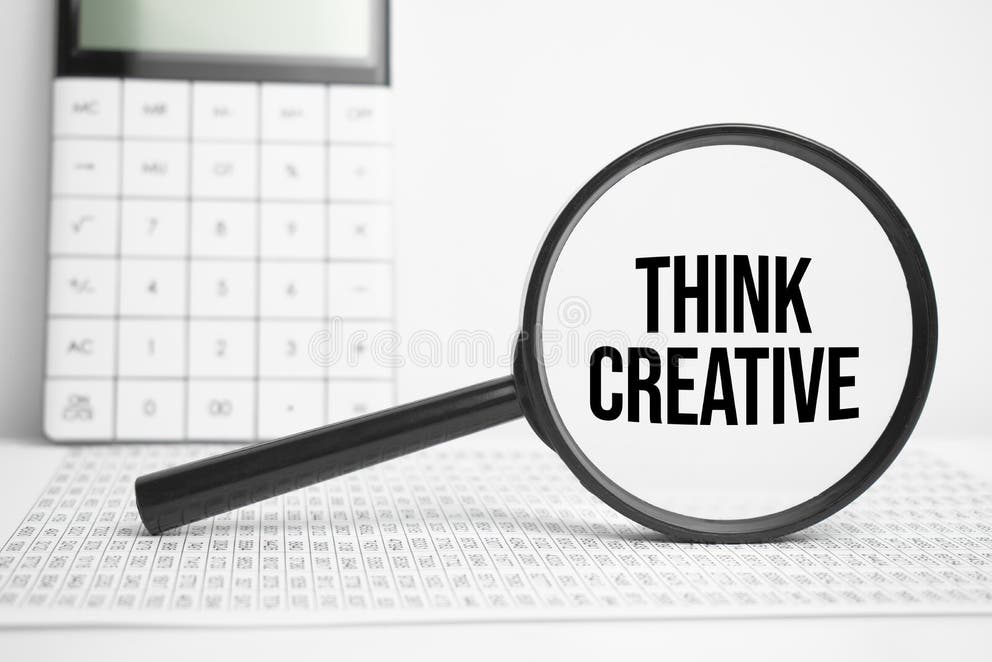 Magnifying Glass with Text Think Creative on White Table with ...