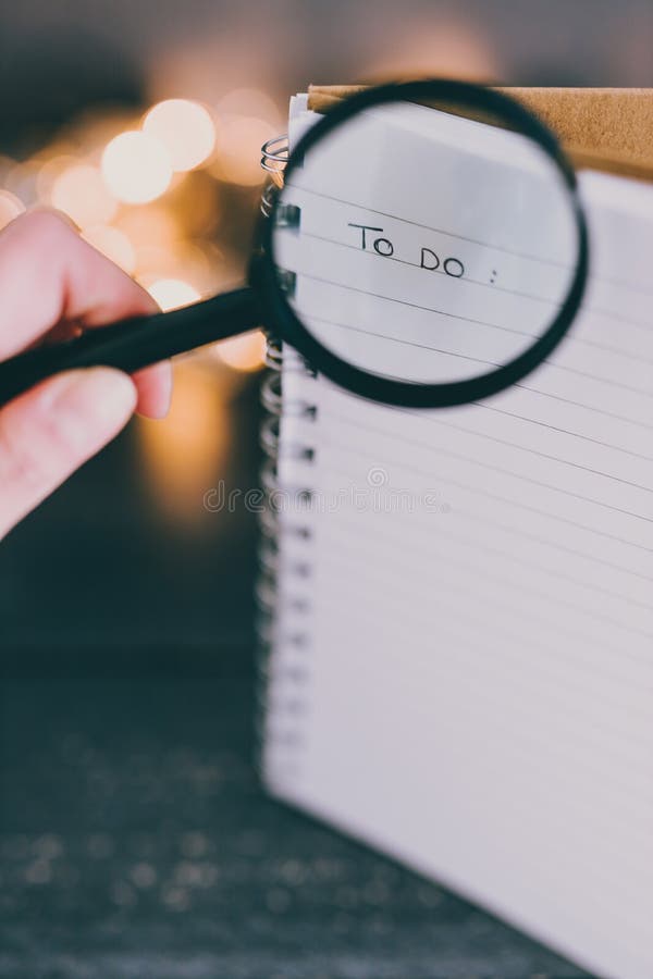 Magnifying Glass on To Do List Surrounded by Lightbulb String Lights ...
