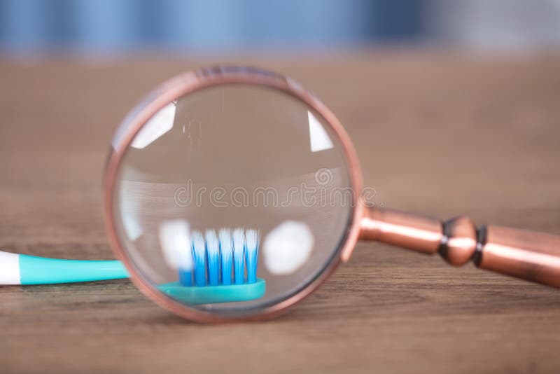 Magnifying Glass To View the Brush Head of the Toothbrush Stock Image ...