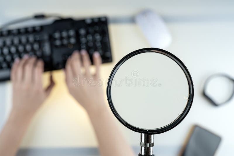 Magnifying Glass Top View. Businesswoman Using a Computer Searching for ...