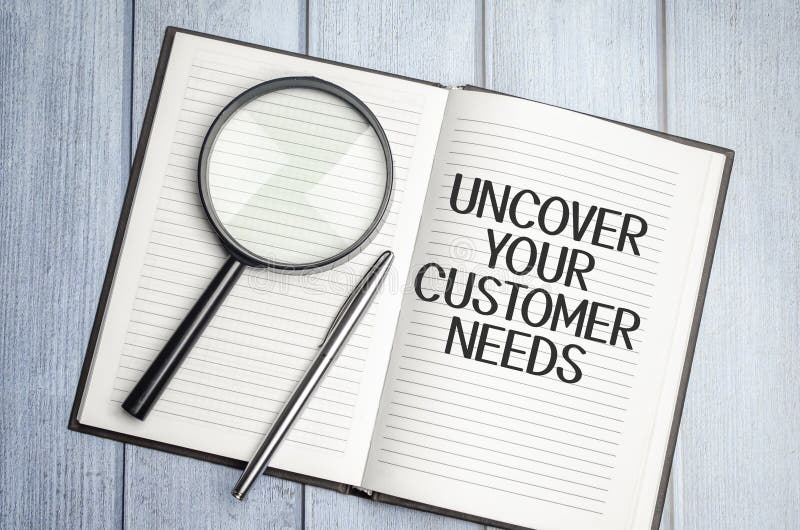 Magnifying Glass and a White Notebook with the Text Uncover Your ...
