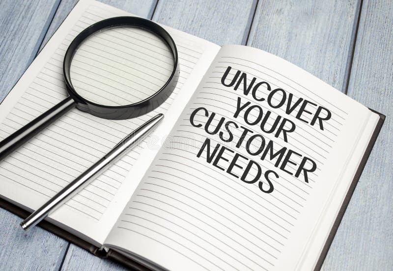Magnifying Glass and a White Notebook with the Text Uncover Your ... Magnifying Glass and a White Notebook with the Text Uncover Your ...
