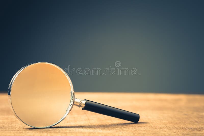 Magnifying Glass on Wood Table Stock Photo - Image of discovery ...