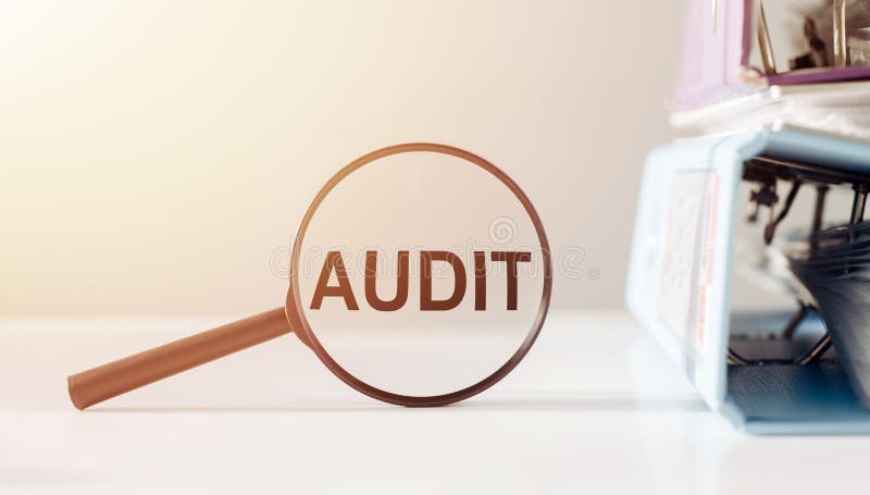 Magnifying Glass with the Word AUDIT on Office Table Stock Photo ...
