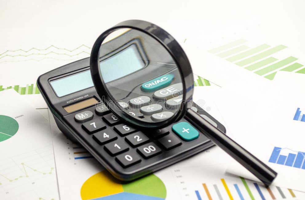 Magnifying Glass and Working Paper with Calculator Stock Photo - Image ...