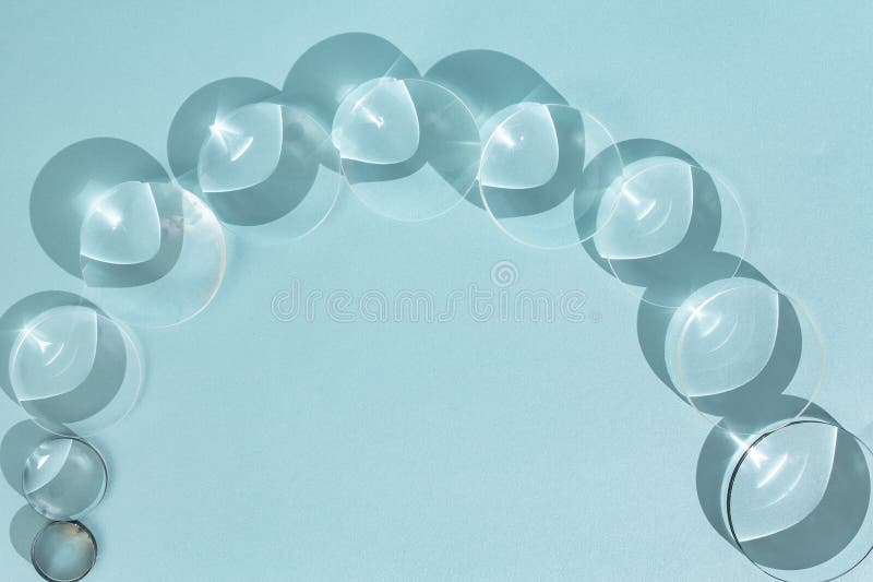 Magnifying Lenses in Arch Shape Flat Lay on Blue Background with Hard ...