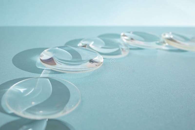 Magnifying Lenses in Arch Shape Side View Close Up on Blue Background ...