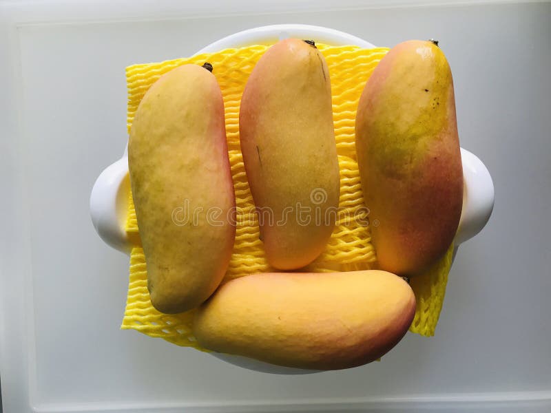 Maha Chanok Rainbow Mango Cut in Half Showing Yellow Orange Texture ...
