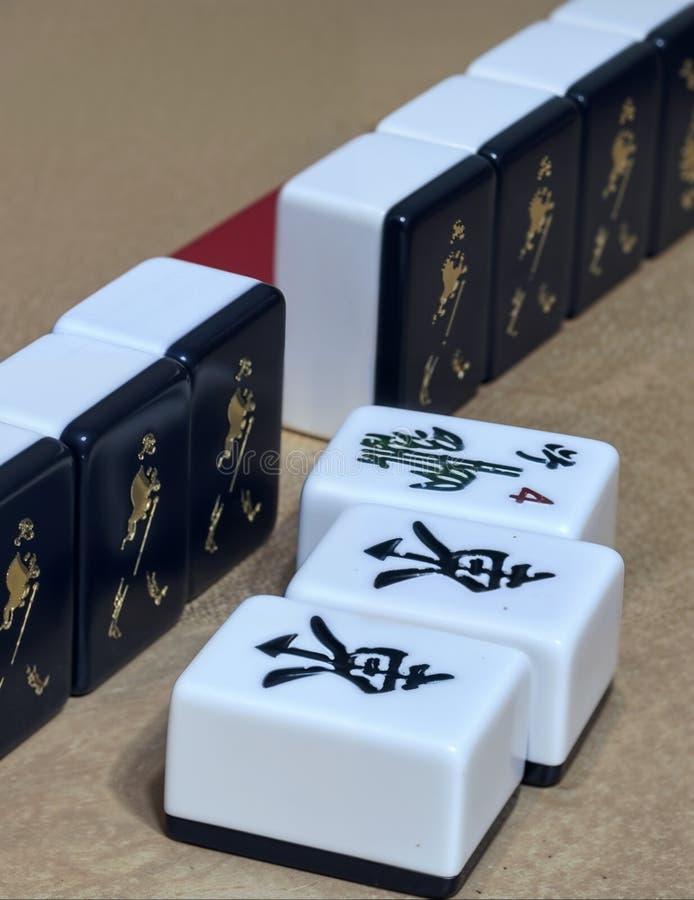 Mahjong Game Pieces in Black and White, Neatly Lined Up on a Table ...