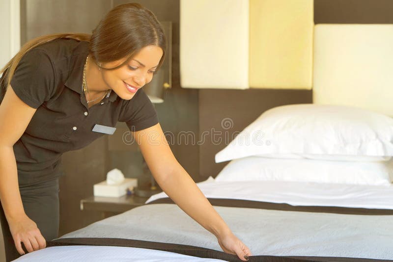 Maid Making Bed stock image. Image of housekeeper, hostel - 164151427
