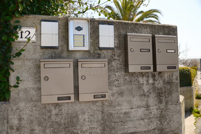 Mail Boxes and Intercoms on Grey Concrete Wall Outdoors Stock Image ...