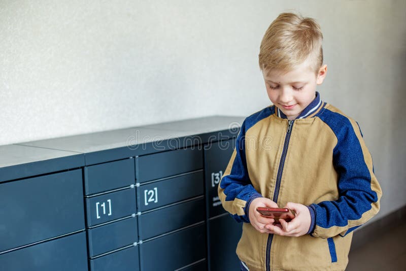 Boy Client Using Automated Self Service Post Terminal Machine or Locker ...