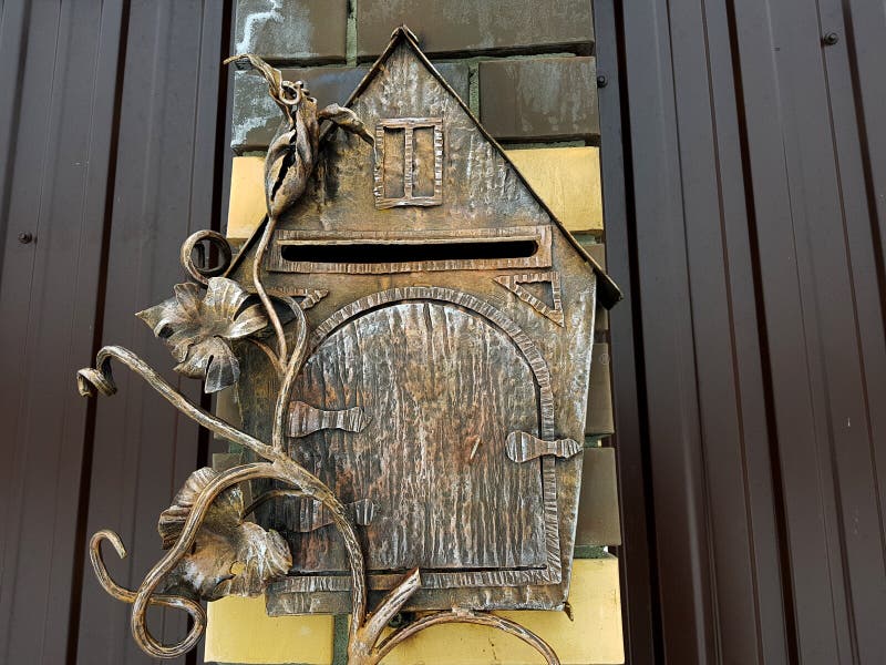 Mailbox with forged items stock image. Image of closed - 140946361