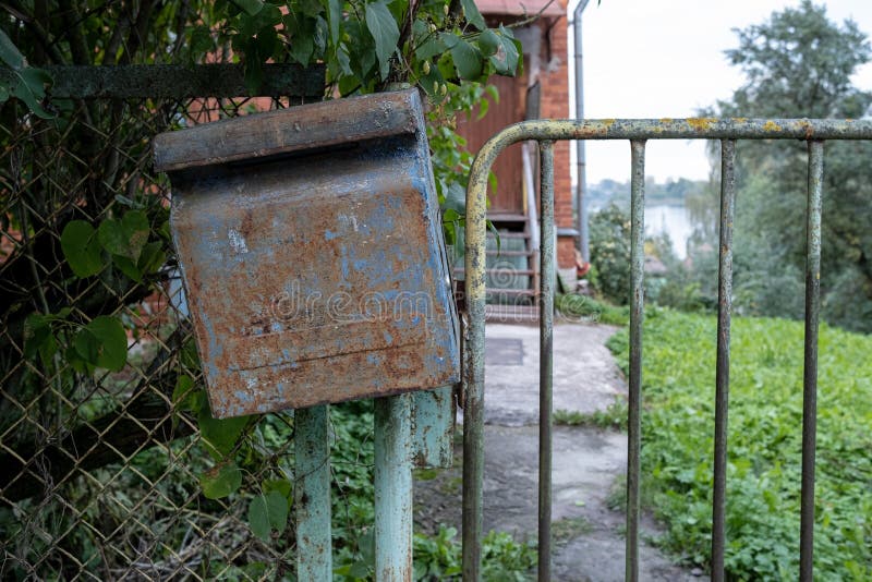 Mailbox is Hanging on the Fence. Old, Rusty Mailbox with Peeling Paint ...
