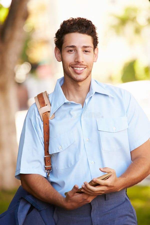Mailman Walking Along Street Delivering Letters Stock Photo - Image of ...