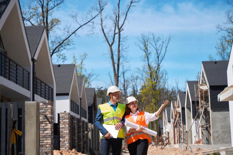 Main Construction Worker Showing Construction Site To Housing Developer ...