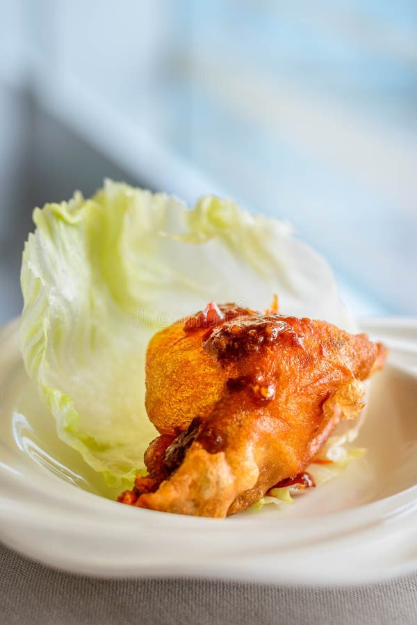 A Main Course of Deep Fried Oyster in Lettuce Cup Served in a White ...