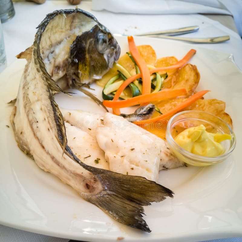 Main Course with Roast Fish, Thin Potatoes, Carrots, Zucchini and Sauce ...