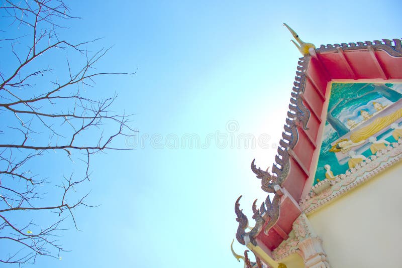 The Main Hall of Buddhism in Thai Temple and Branch Tree and Blue Sky ...