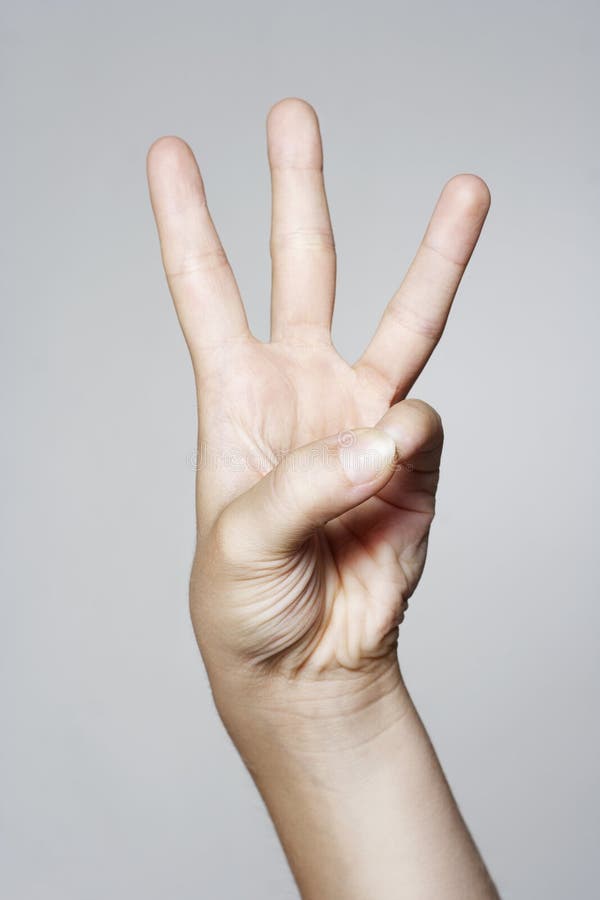 Main montrant trois doigts image stock. Image du gesticulant - 31217783