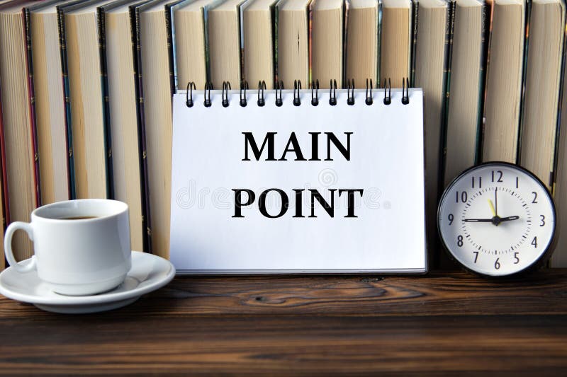MAIN POINT - Words on White Notebook on Background of Books, Clock and ...