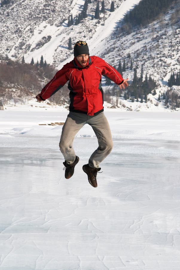 Main in Red Jumping on Winter Lake Stock Photo - Image of outdoors ...