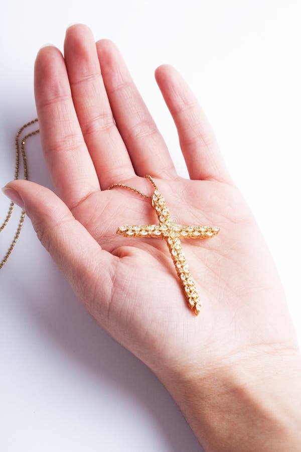 Main retenant une croix photo stock. Image du dieu, blanc - 27948556