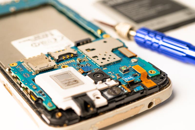 Mainboard Circuit Inside of Mobile Phone with Soldering Iron Stock ...