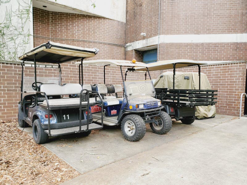3 Maintenance Carts Parked by Brick Building Stock Image - Image of ...