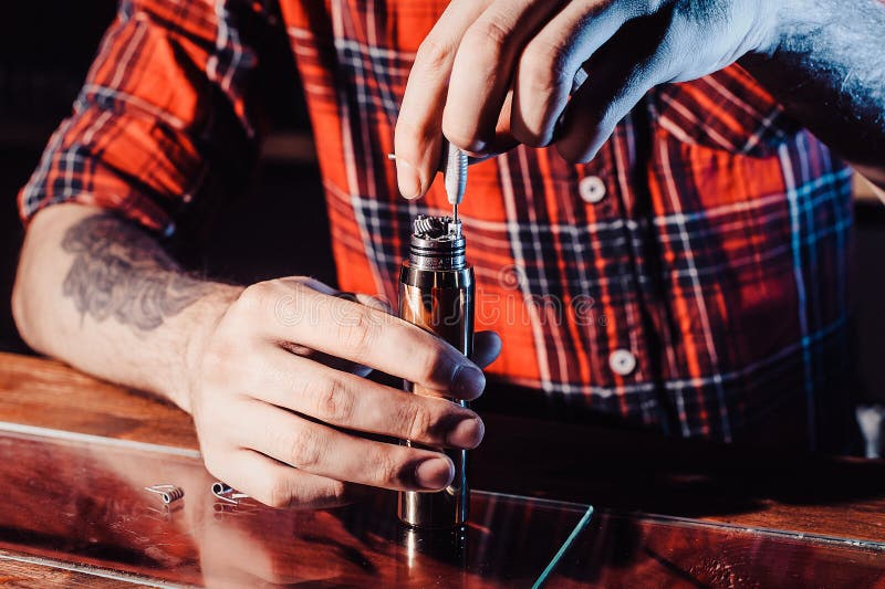 The Process of Servicing the Mechanical Vape Device. Master Replace ...