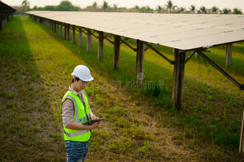 Maintenance Engineer Installing Solar Panels on Solar Cell Farm Stock ...