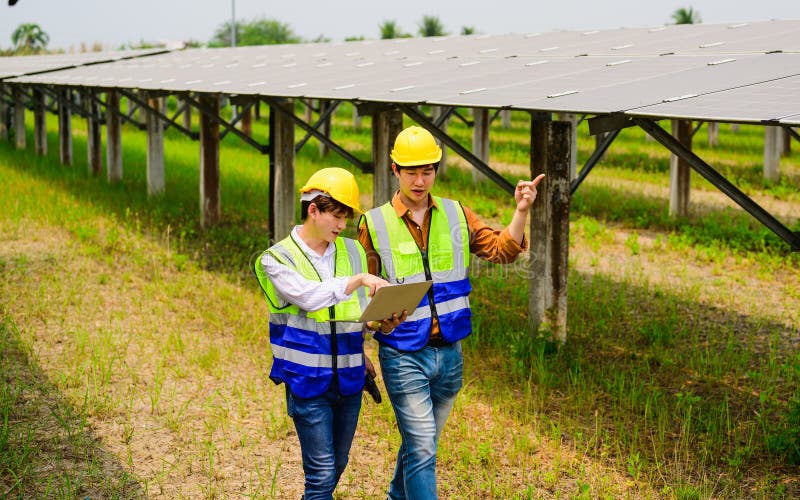 Maintenance Engineer Installing Solar Panels on Solar Cell Farm Stock ...