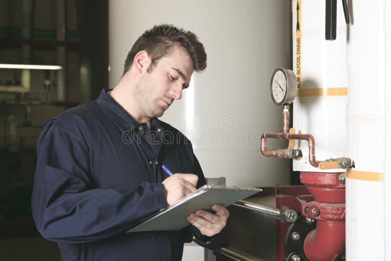 Maintenance Engineer Checking Technical Data of Stock Photo - Image of ...