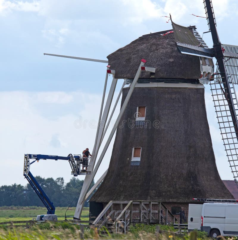 Maintenance Engineer Doing Some Work on an Old Windmill Stock Photo - Image of windmill ...